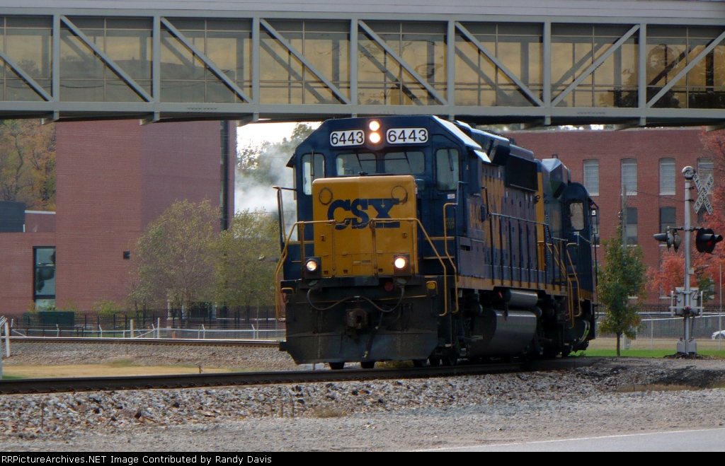 CSX 6443 running light under the hospital walk-over